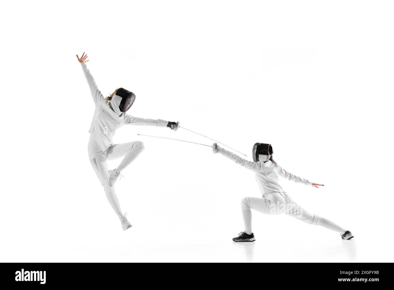 Two competitors face off in high-energy fencing practice, refining ...