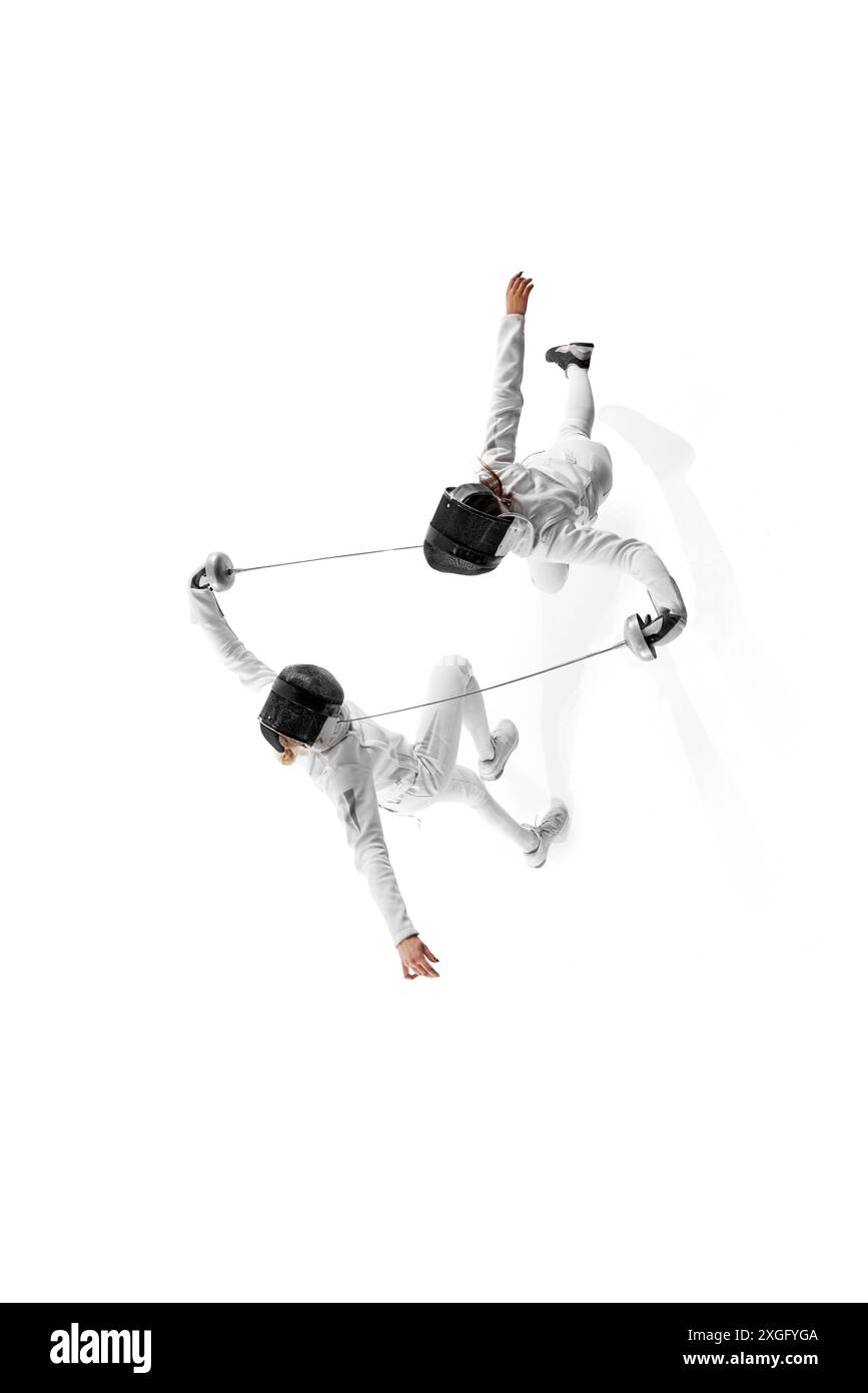 Poster. View from above of two fencers face off in dynamic training ...