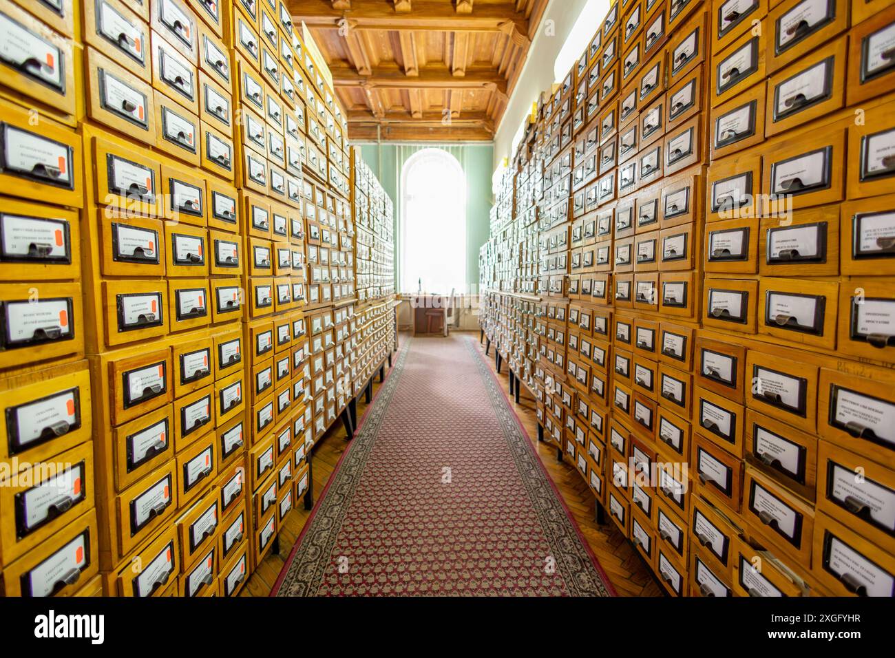 card index with cards in a library. Rows of wooden boxes with ...