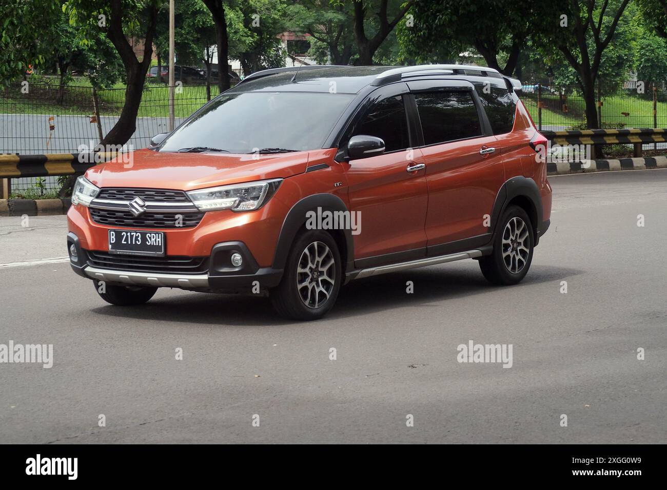 orange color SUV vehicle, Suzuki XL7 car driving at TB Simatupang ...