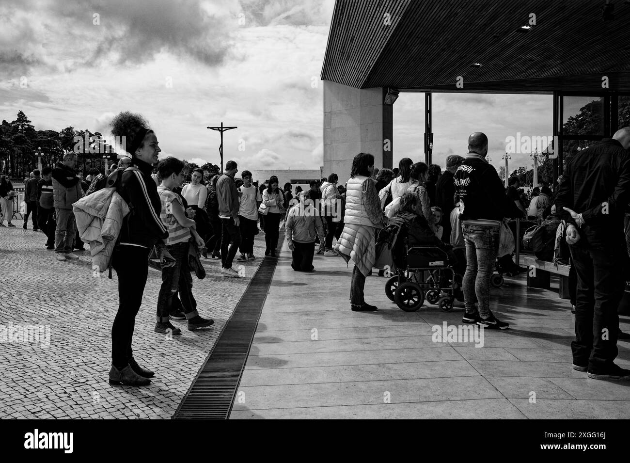 A middle aged man crawls on his knees through the chapel of apparitions ...