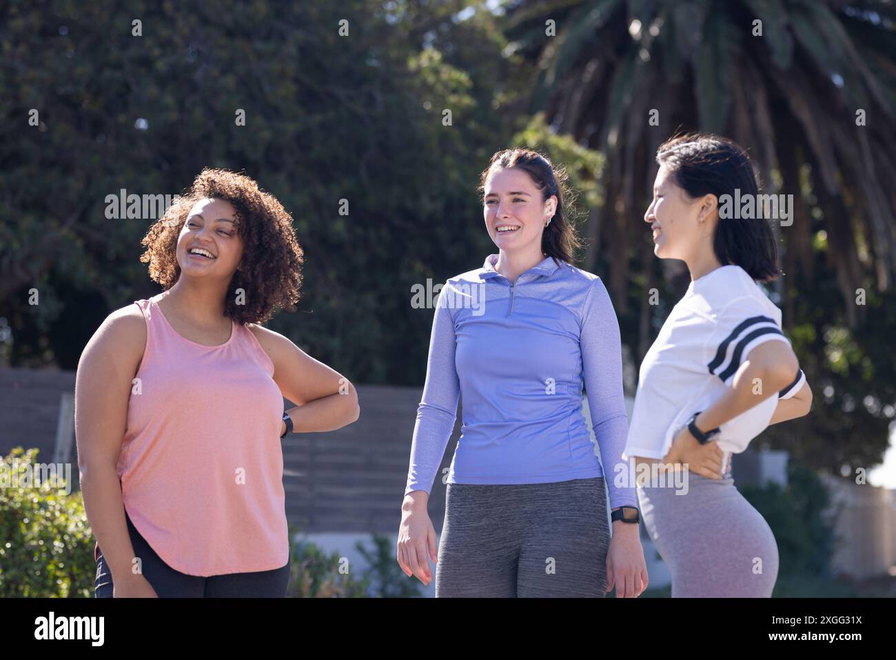 Smiling friends jogging together hi-res stock photography and images ...