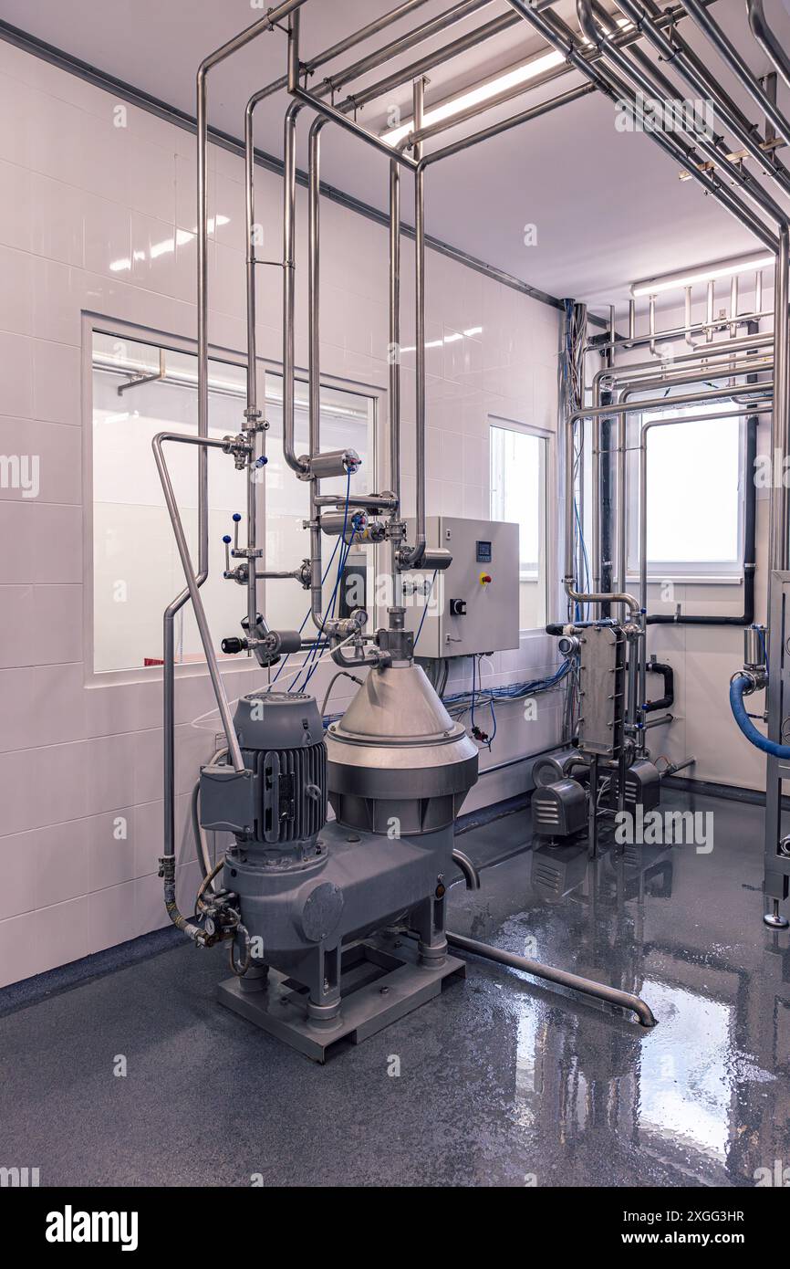 Shiny steel industrial separator machine standing on the production ...