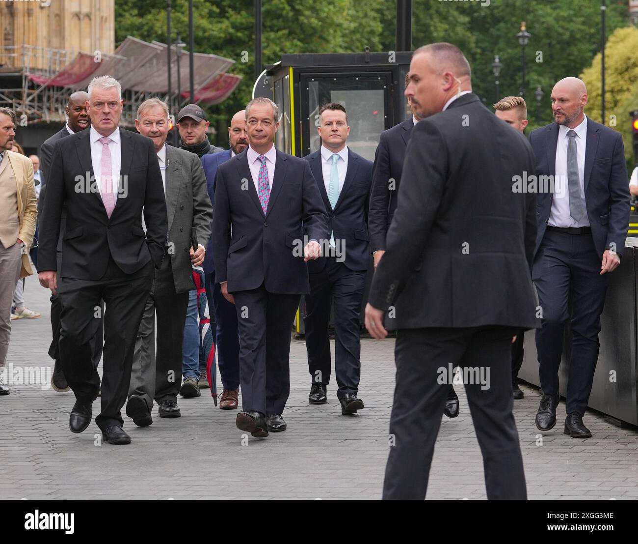 (Front row, left to right) Reform UK MP Lee Anderson, Reform UK leader Nigel Farage, and (second ...