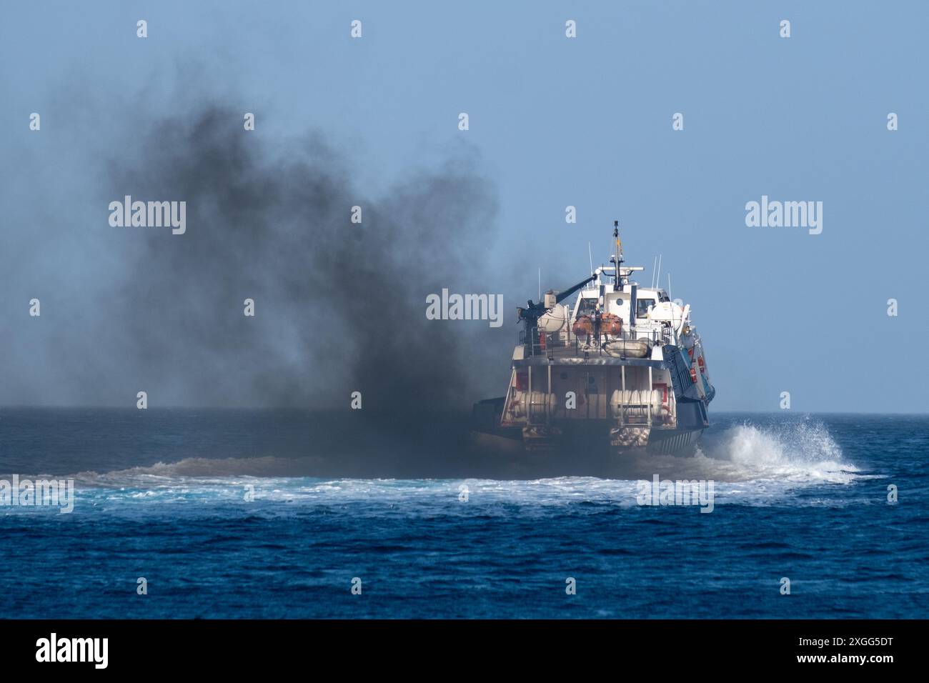 Fast hydrofoil from behind after take-off on the island of Vulcano ...