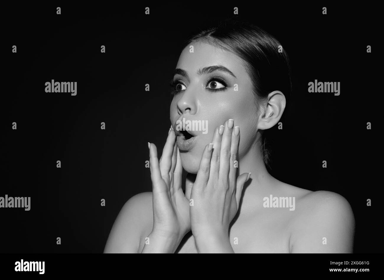 Close up photo of impressed woman isolated over studio background ...