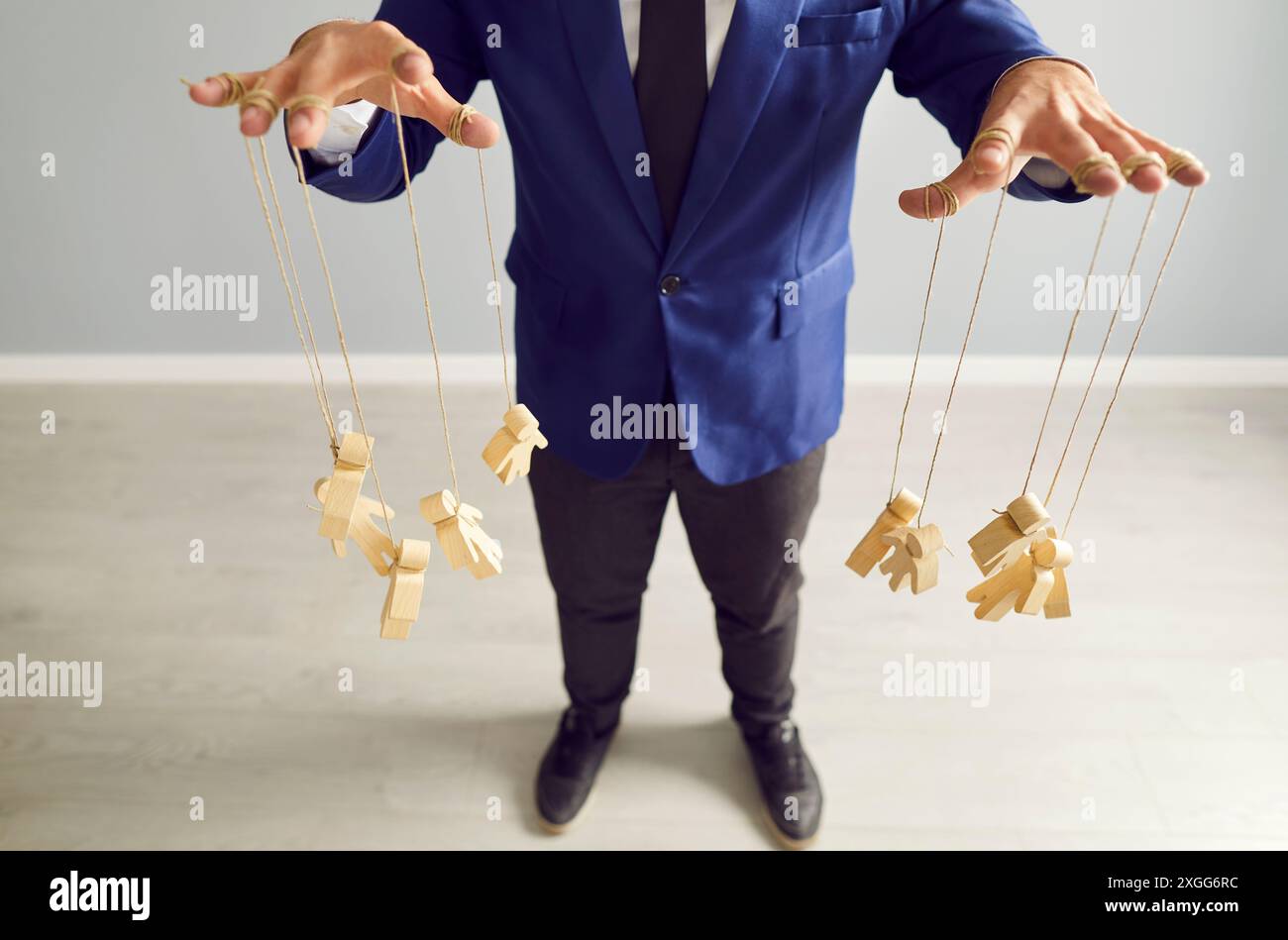 Man Manipulating Wooden Marionettes Or Puppets Stock Photo - Alamy