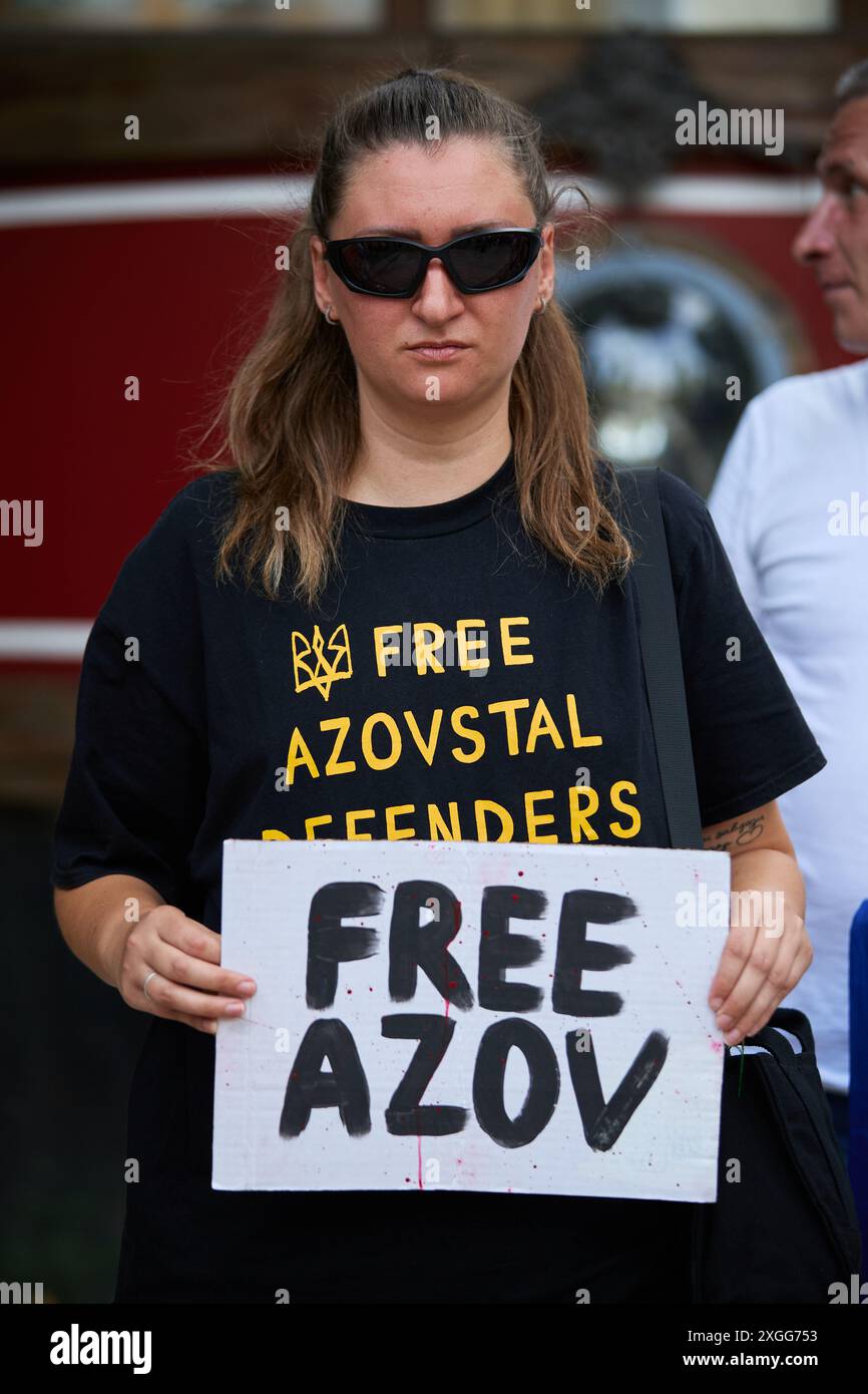 Ukrainian woman posing with a sign "Free Azov" on a public action in Kyiv - 7 July,2024 Stock ...
