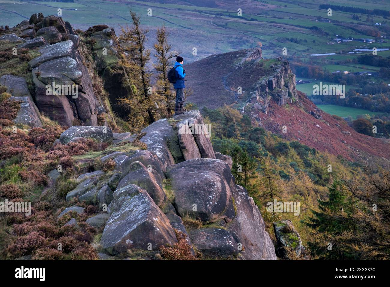 Walker looking out over Hen Cloud from The Roaches rock formation in ...