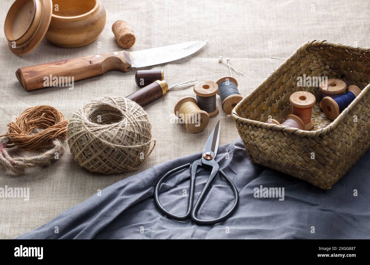 Sewing threads with needles and scissors on a canvas, Uzbekistan ...