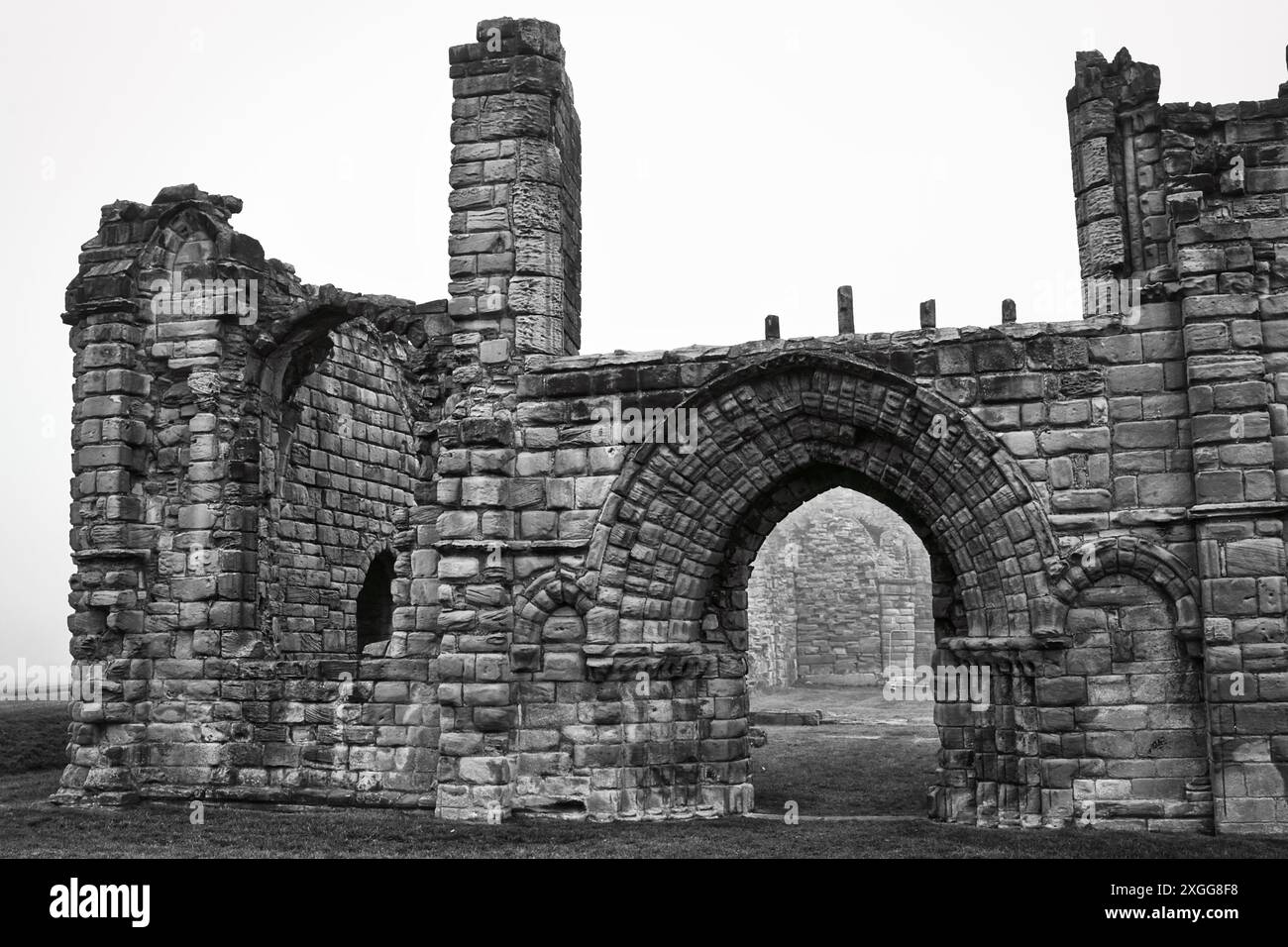 Black and white photo of ancient stone ruins with archways and ...