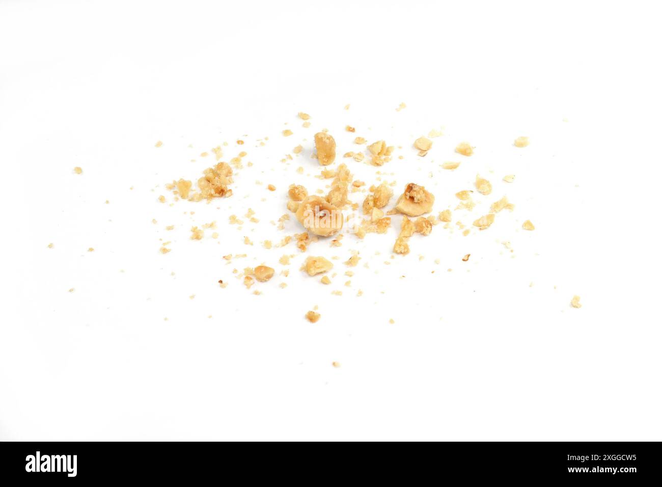 Ground, milled, crushed or granulated hazelnut pile isolated on white ...