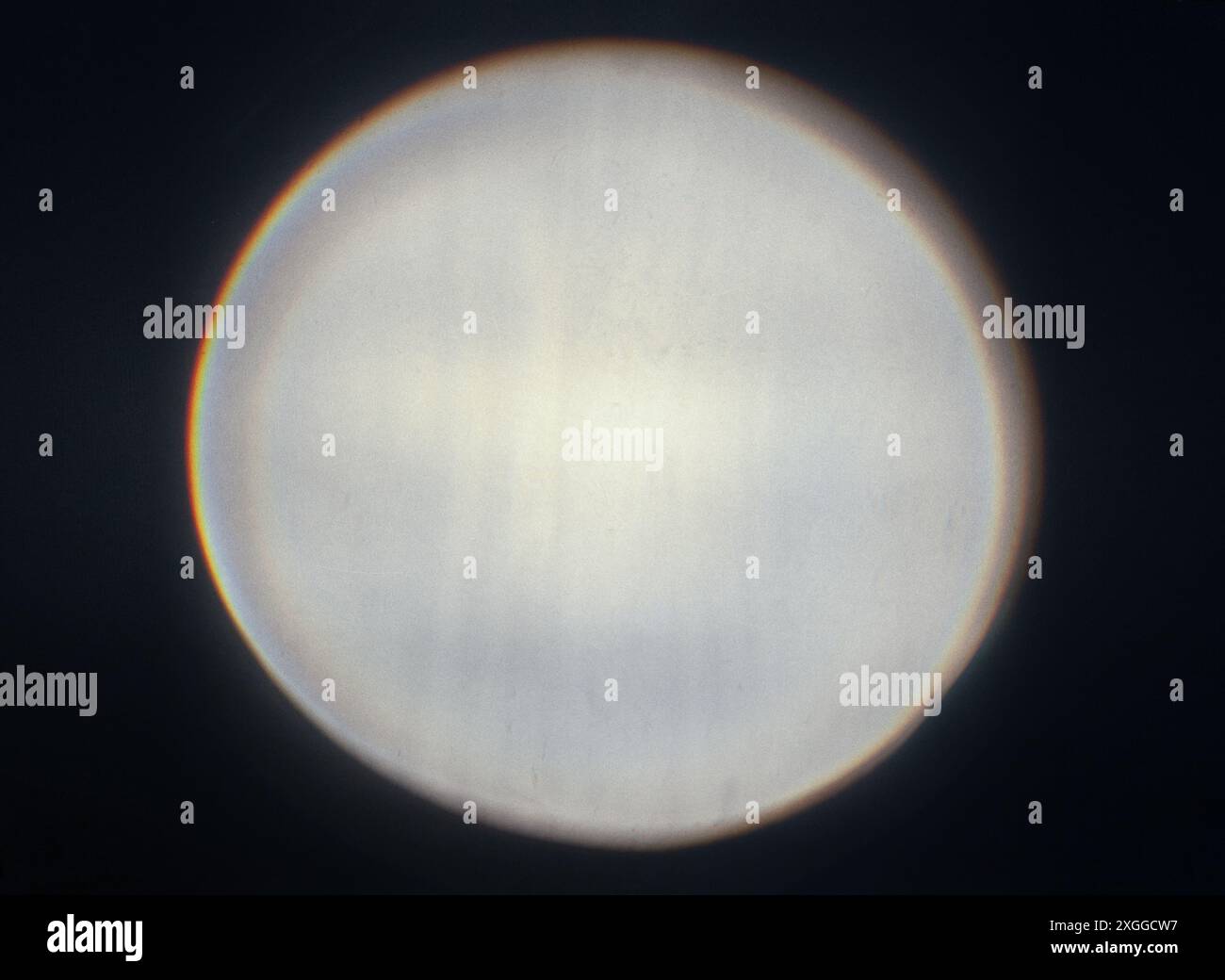 The circle of light on a black background coming from the overhead ...