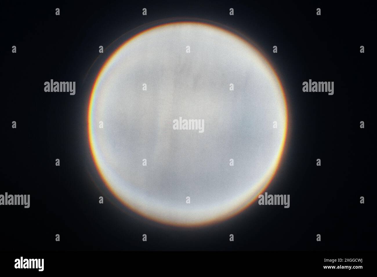 The circle of light on a black background coming from the overhead ...