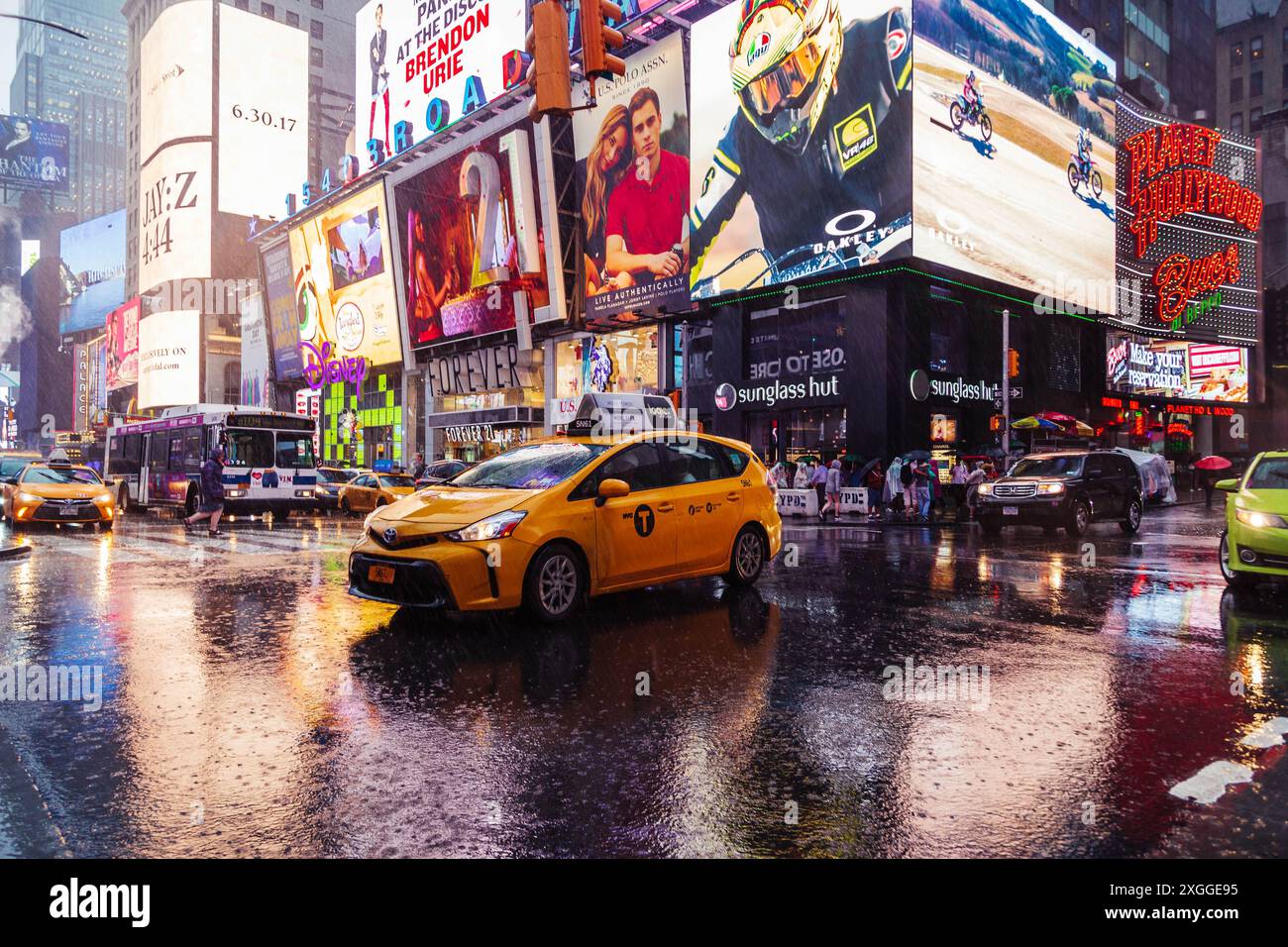 Yellow Taxi and Traffic on Times Square at Night During a Heavy Rain ...