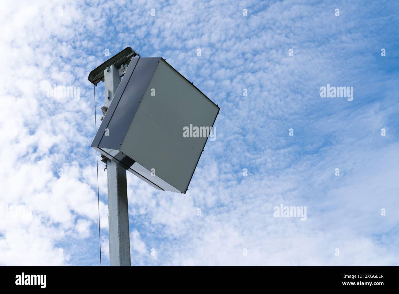 A square antenna wiht copy space is mounted on a pole and pointed ...