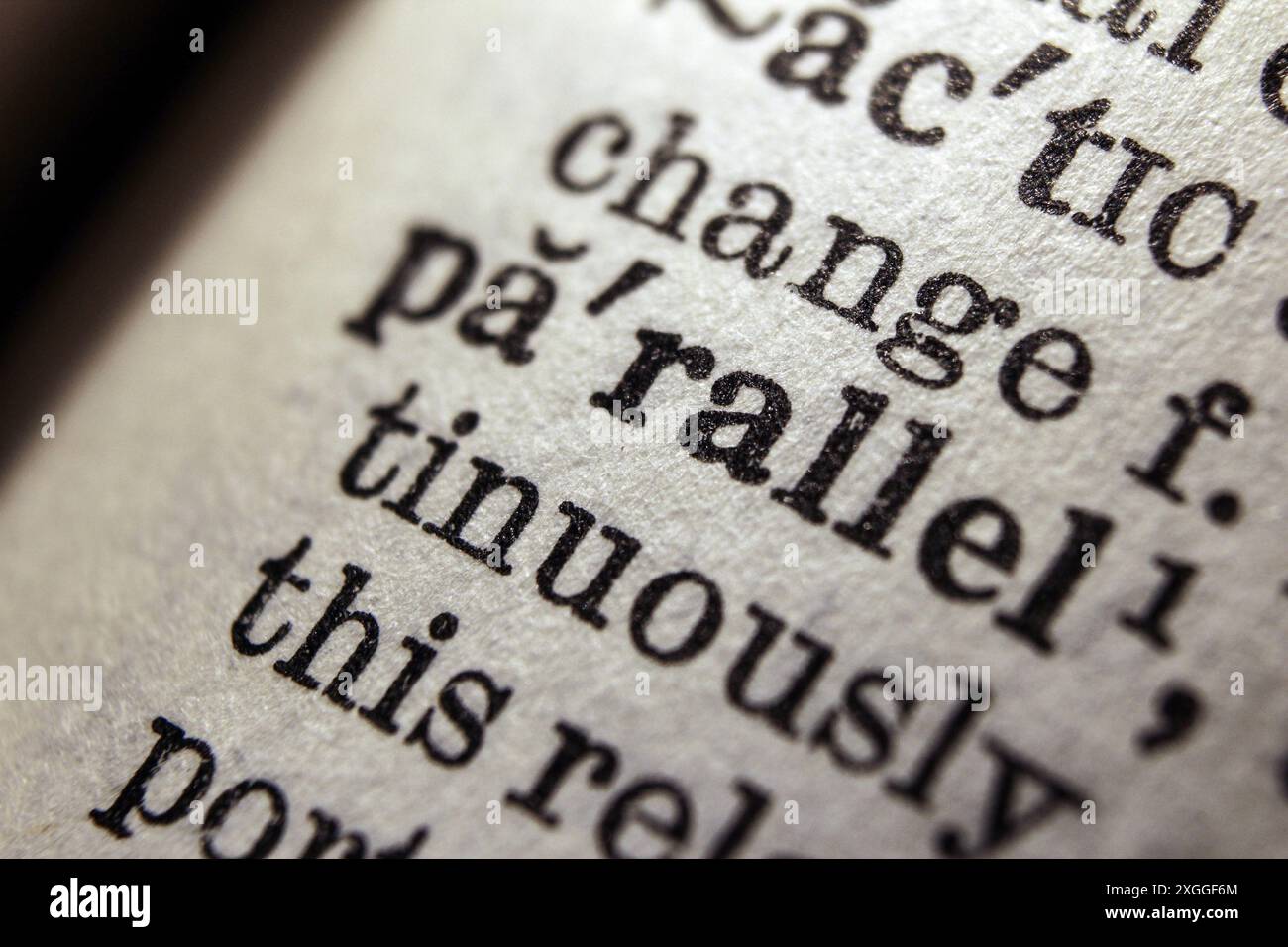 Word parallel on dictionary page, macro close-up Stock Photo - Alamy