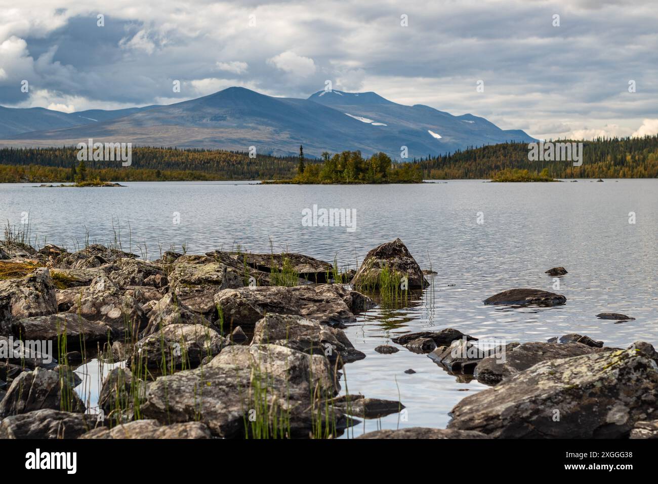 The crystal clear lake on a hiking trail Kungsleden in northern Sweden ...