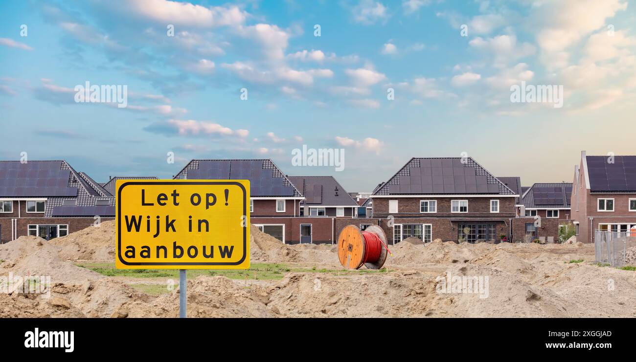 Traffic sign with the Dutch text for "Attention - Residential area ...
