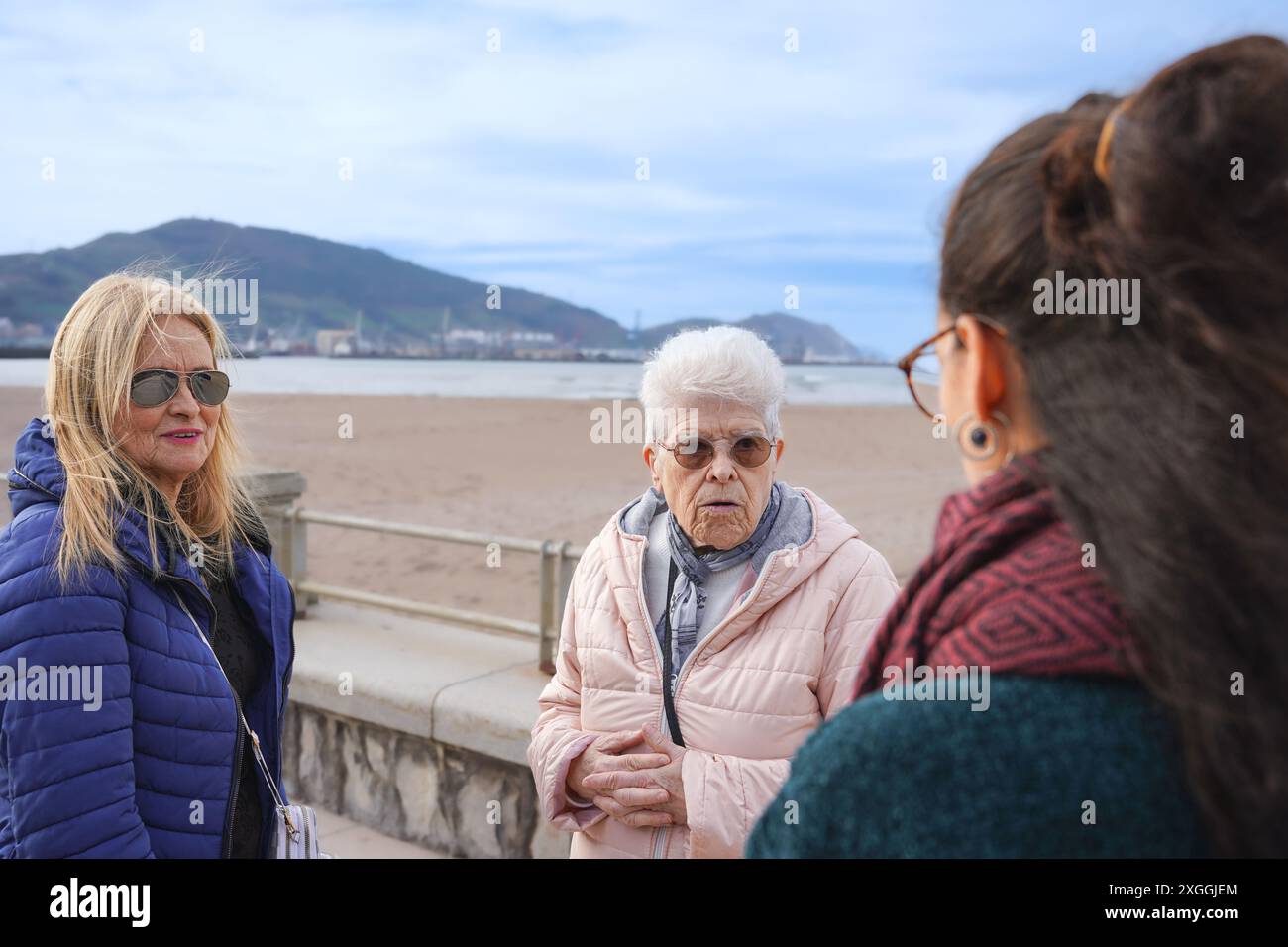 three women from the same family talking outside. Big family of ...