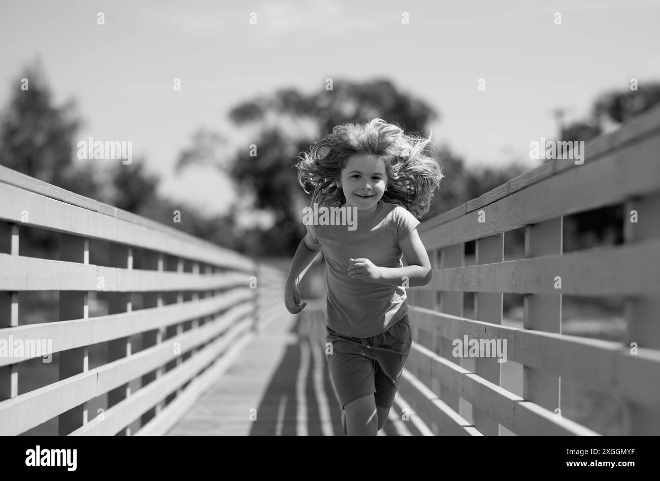 Sporty kid running in nature. Active healthy child boy runner run ...