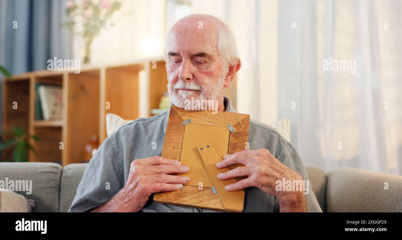 Memory, senior man and thinking with picture frame for nostalgia ...