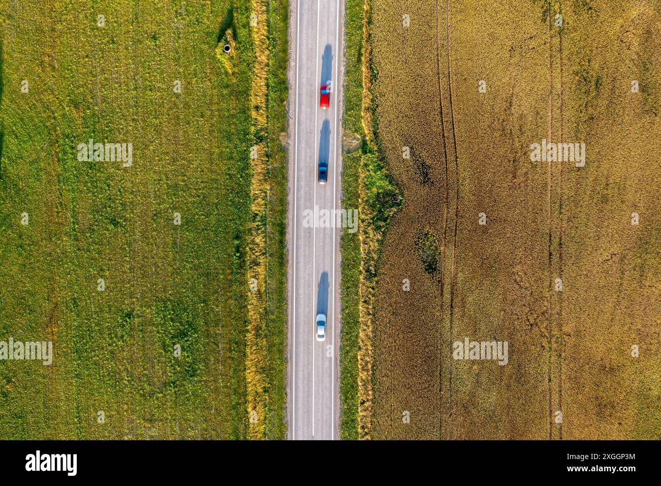 Cars drive along country road hi-res stock photography and images - Alamy