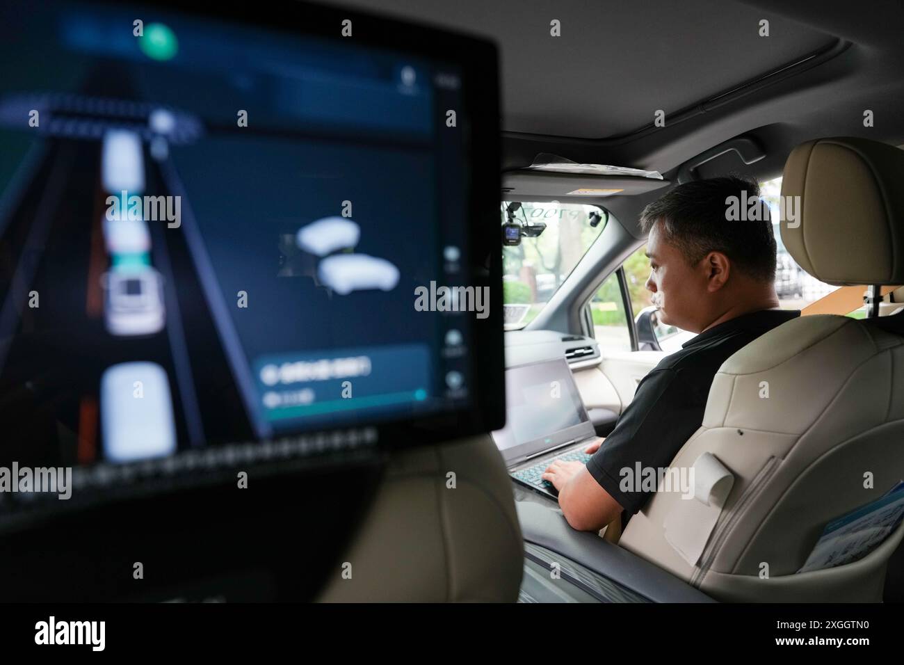 (240709) -- BEIJING, July 9, 2024 (Xinhua) -- Wang Wei conducts road ...