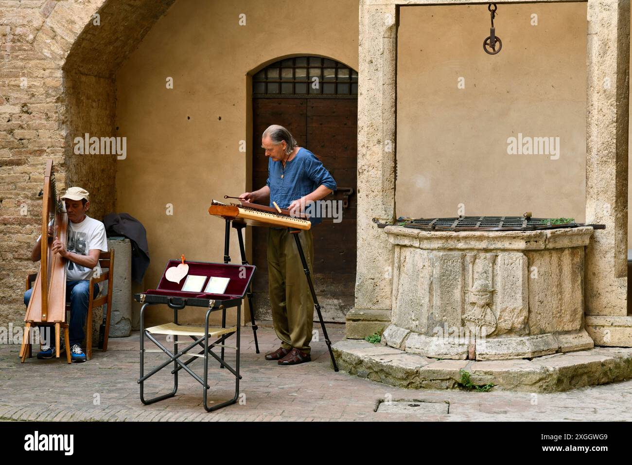 San Gimignano in Tuscany, Italy, musicians playing historic instruments ...