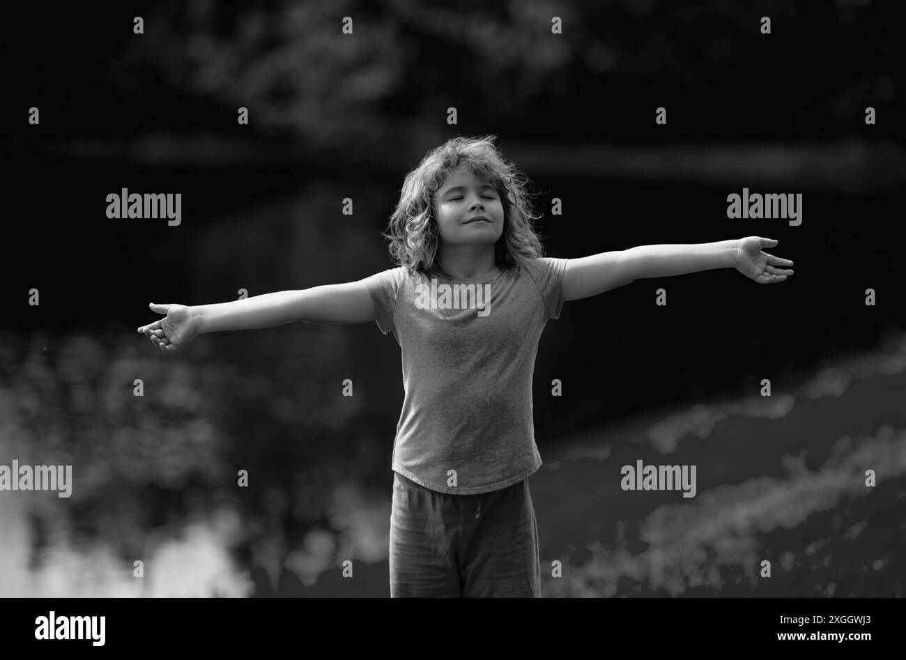 Happy child with arms up enjoying freedom in nature. Child ppen arms ...