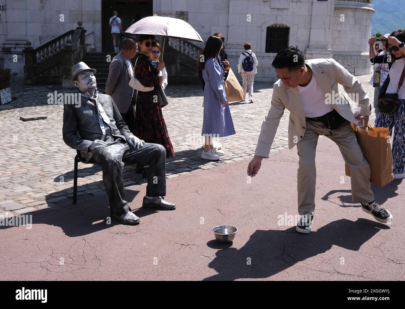 Mime artist entertaining tourists in the streets of Annecy, France ...