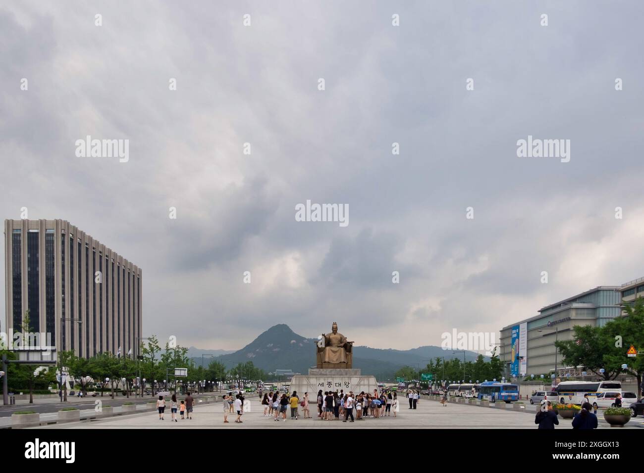 Iconic statue of King Sejong in Seoul plaza, surrounded by tourists ...