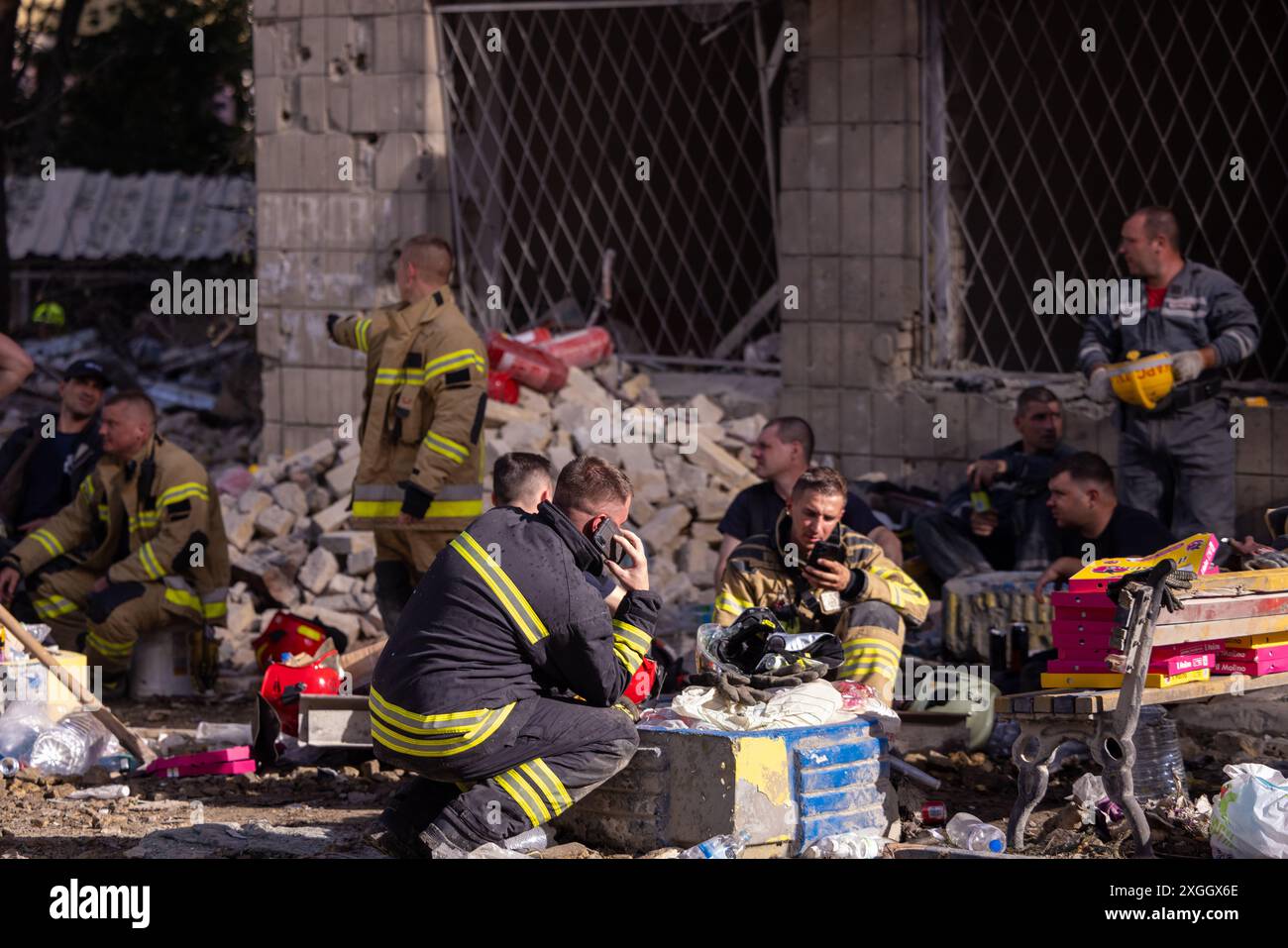 Kyiv, Ukraine, July-08-2024. EMS workers rest as search and rescue ...