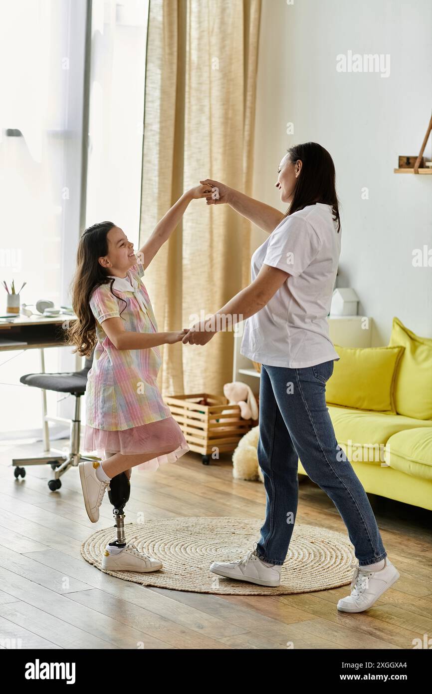 A brunette mother and her daughter with a prosthetic leg are dancing in ...