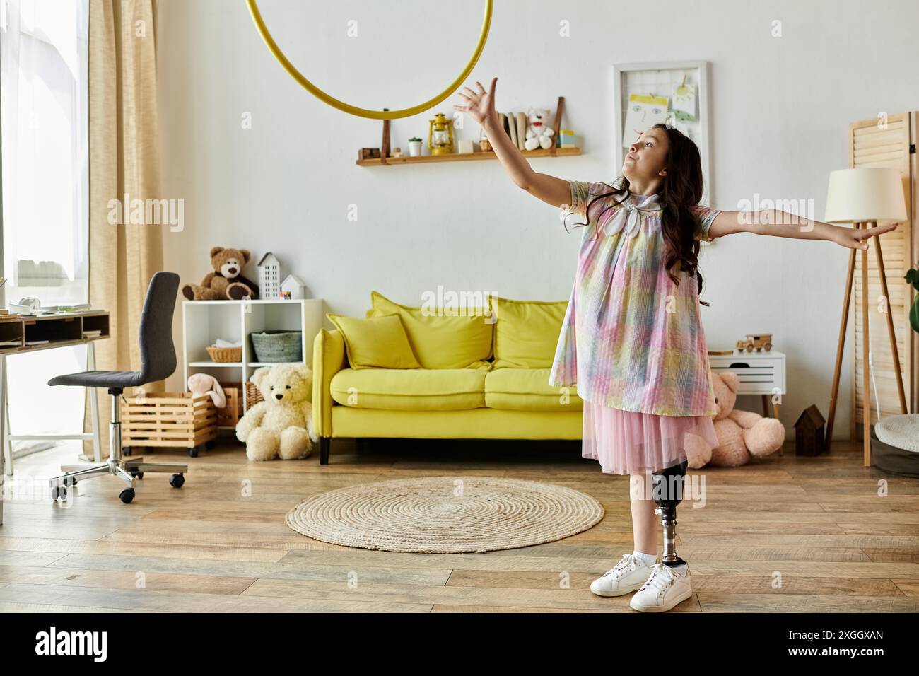 A young girl with a prosthetic leg plays at home, showcasing the joy ...