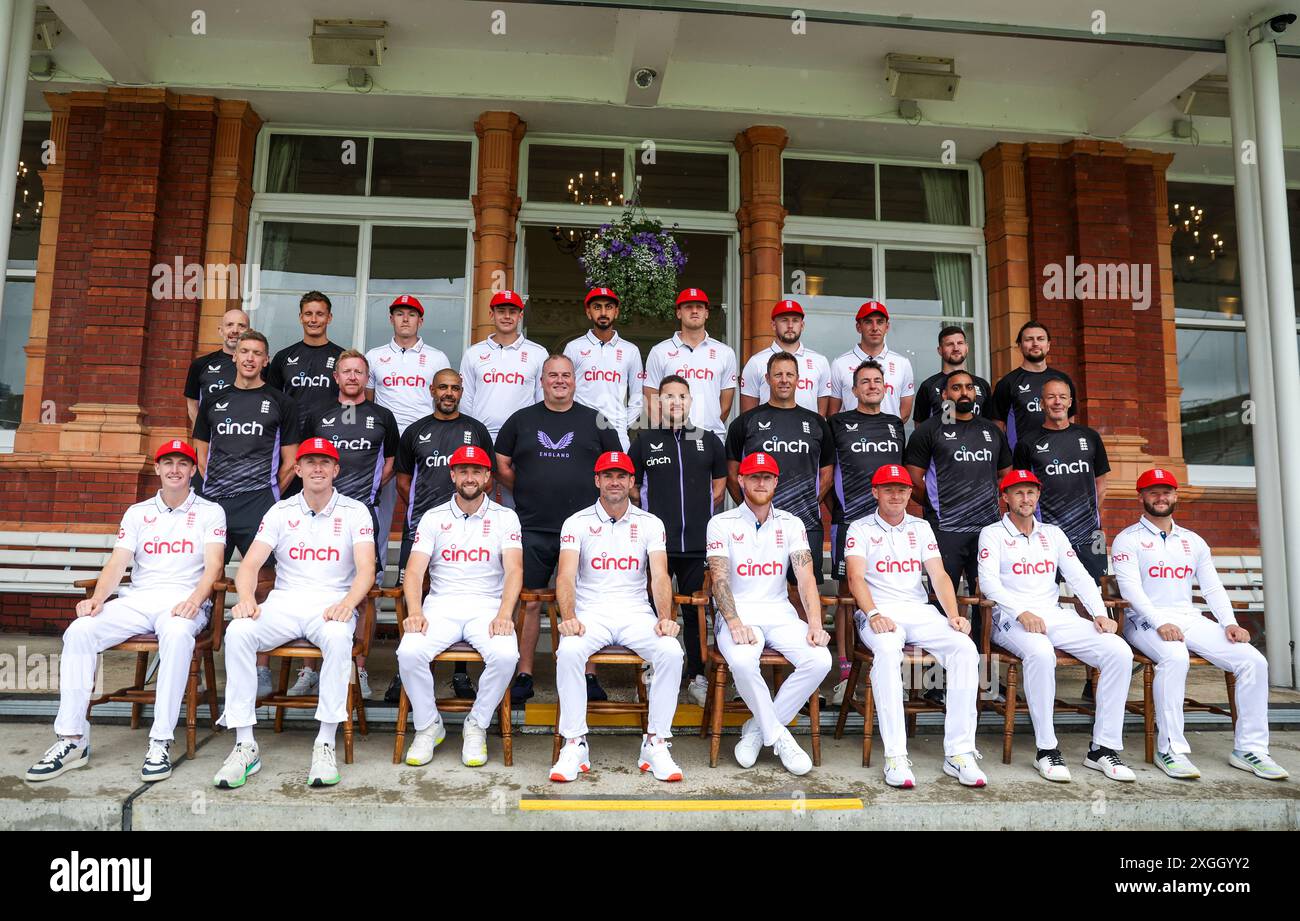 England players and coaching staff pose for a team group following a ...