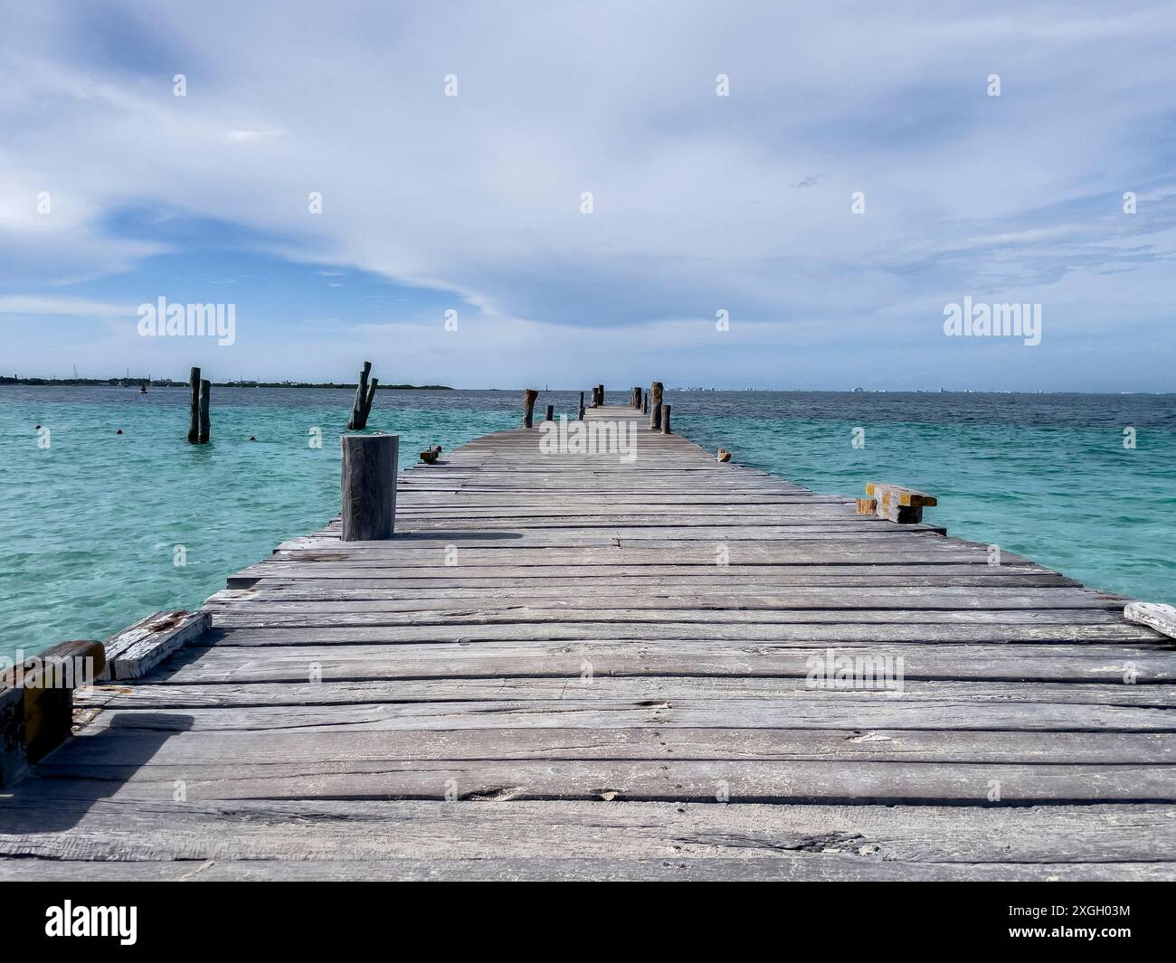 Caribbean beach pier in Isla Mujeres, Mexico. Sand beach Stock Photo ...