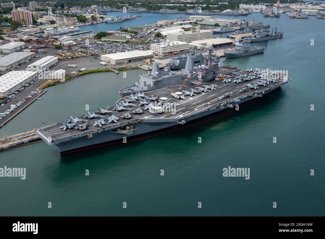An aerial view of Nimitz-class aircraft carrier USS Carl Vinson (CVN 70), moored at Joint Base ...