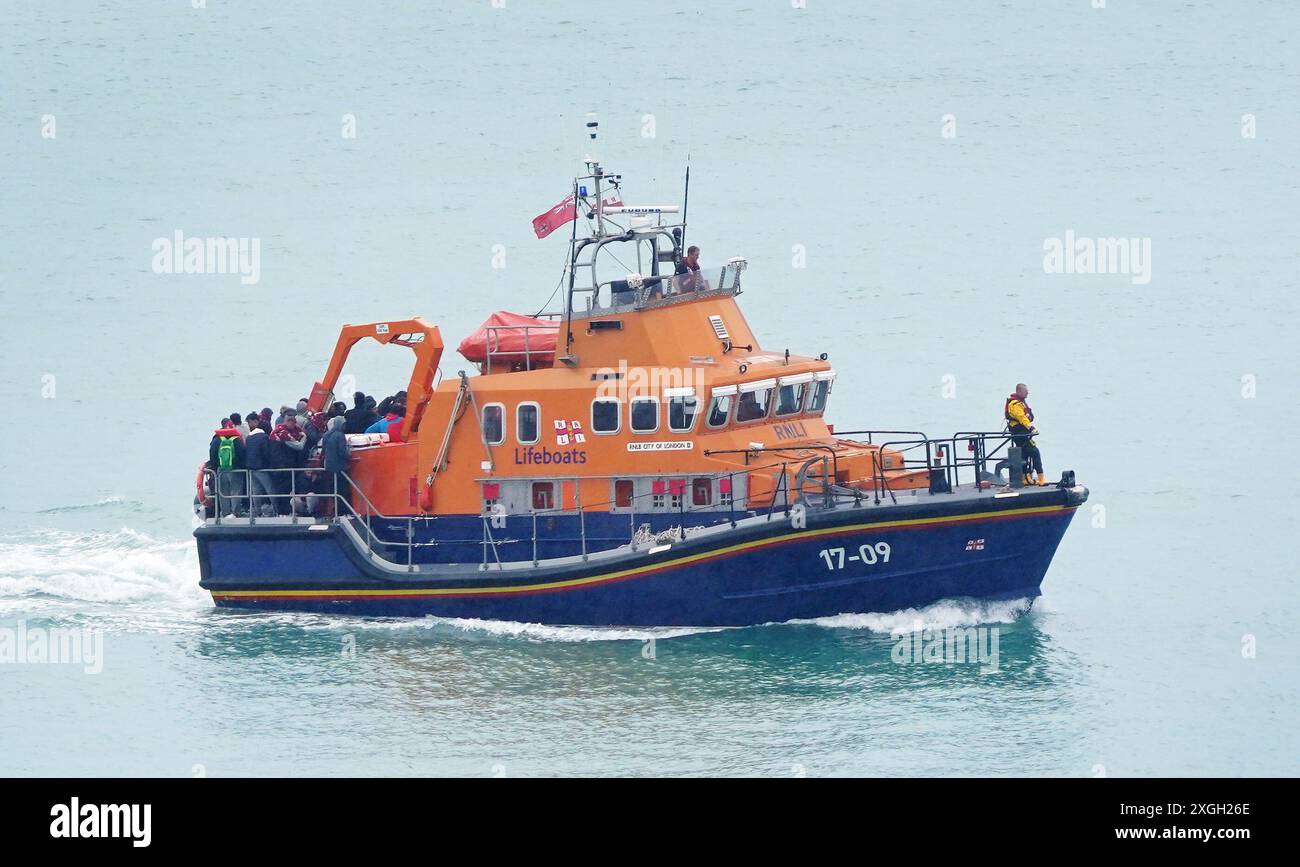 A group of people thought to be migrants are brought in to Dover, Kent ...