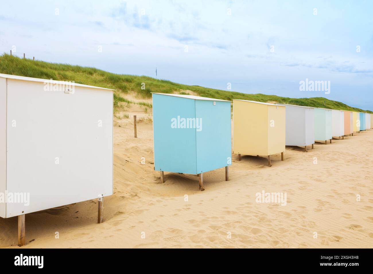 Row of pastel colored beach huts at dutch North Sea beach of ...