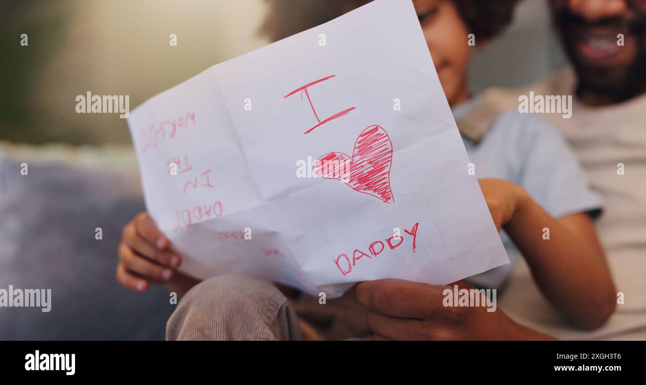Dad, letter and relax with son for love, heart or present on sofa for ...