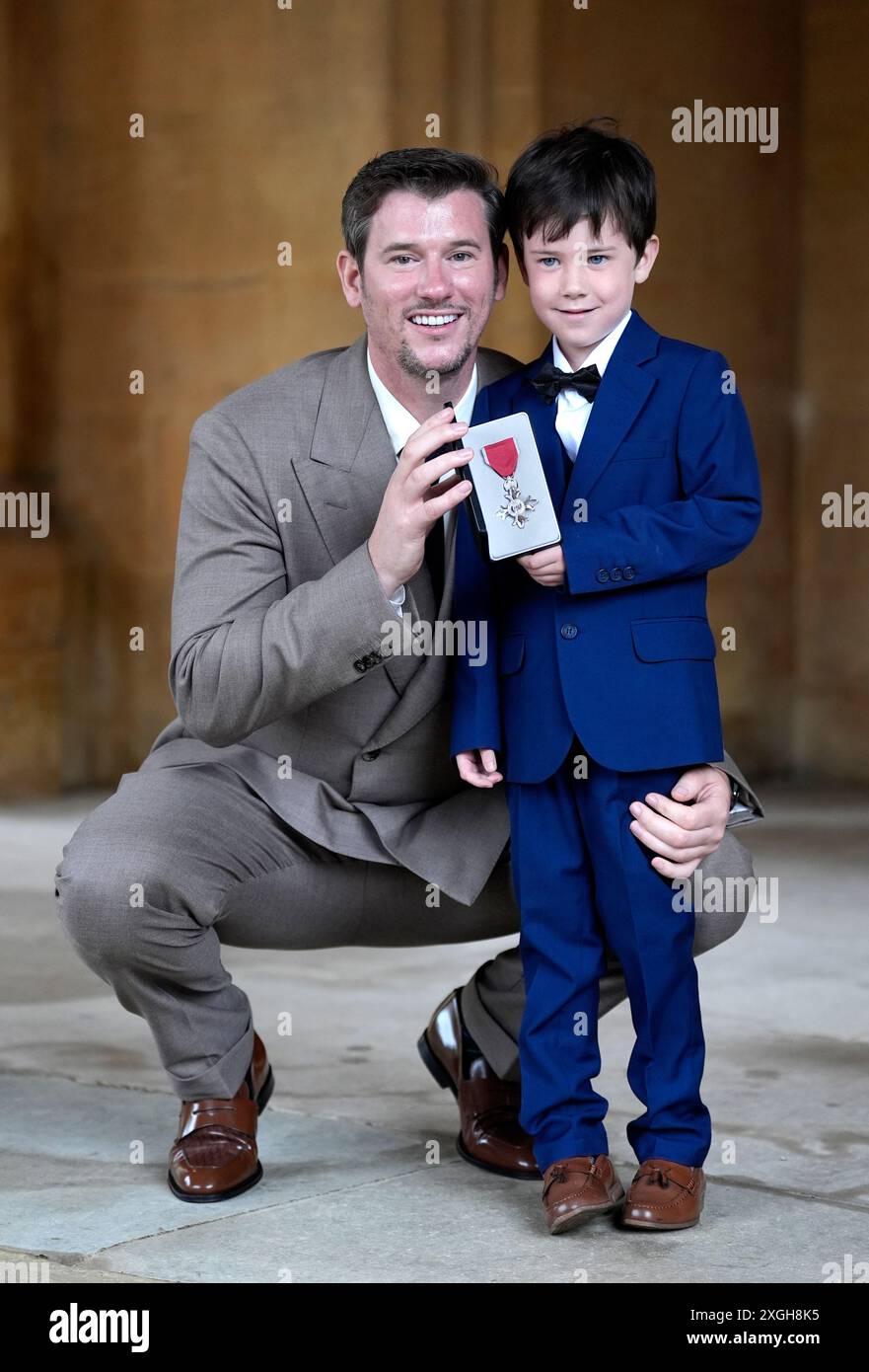 Chef Adam Handling (left) with his son Oliver after being made a Member ...