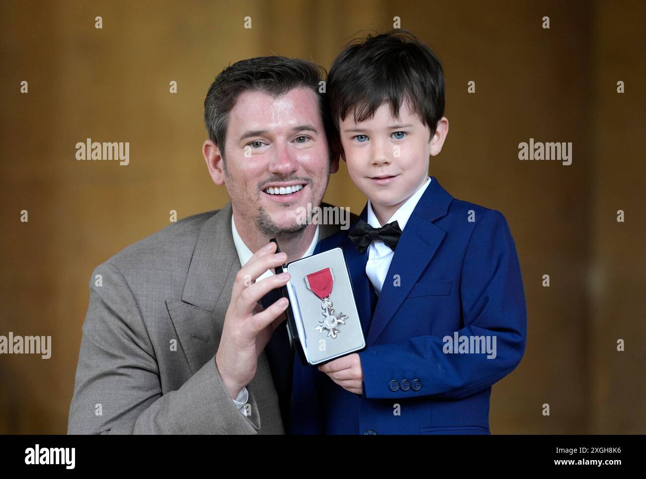 Chef Adam Handling (left) with his son Oliver after being made a Member ...