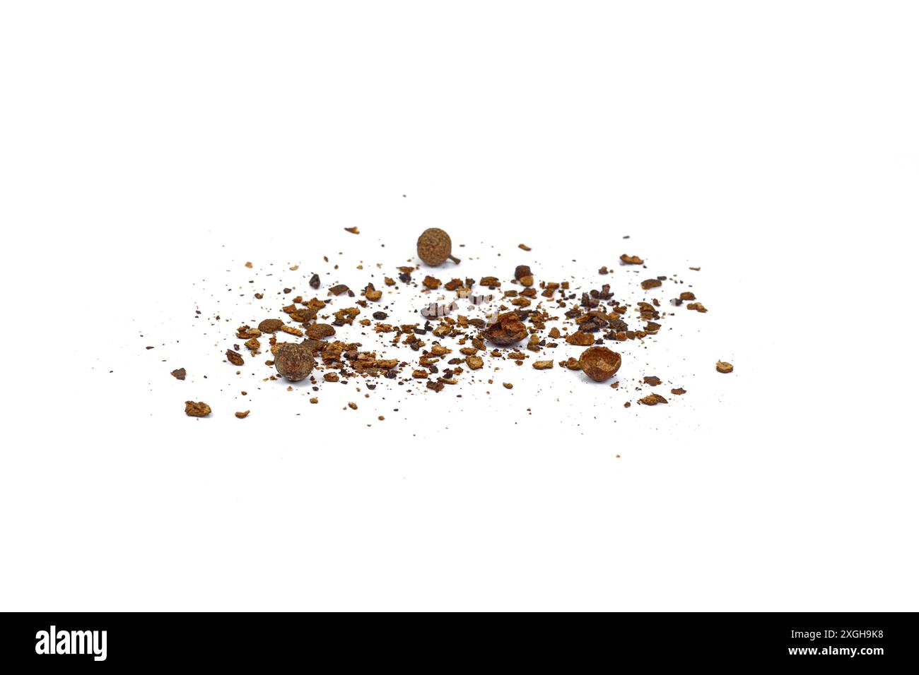 Ground Allspice, crushed pimento spice, Jamaican pepper pile isolated ...