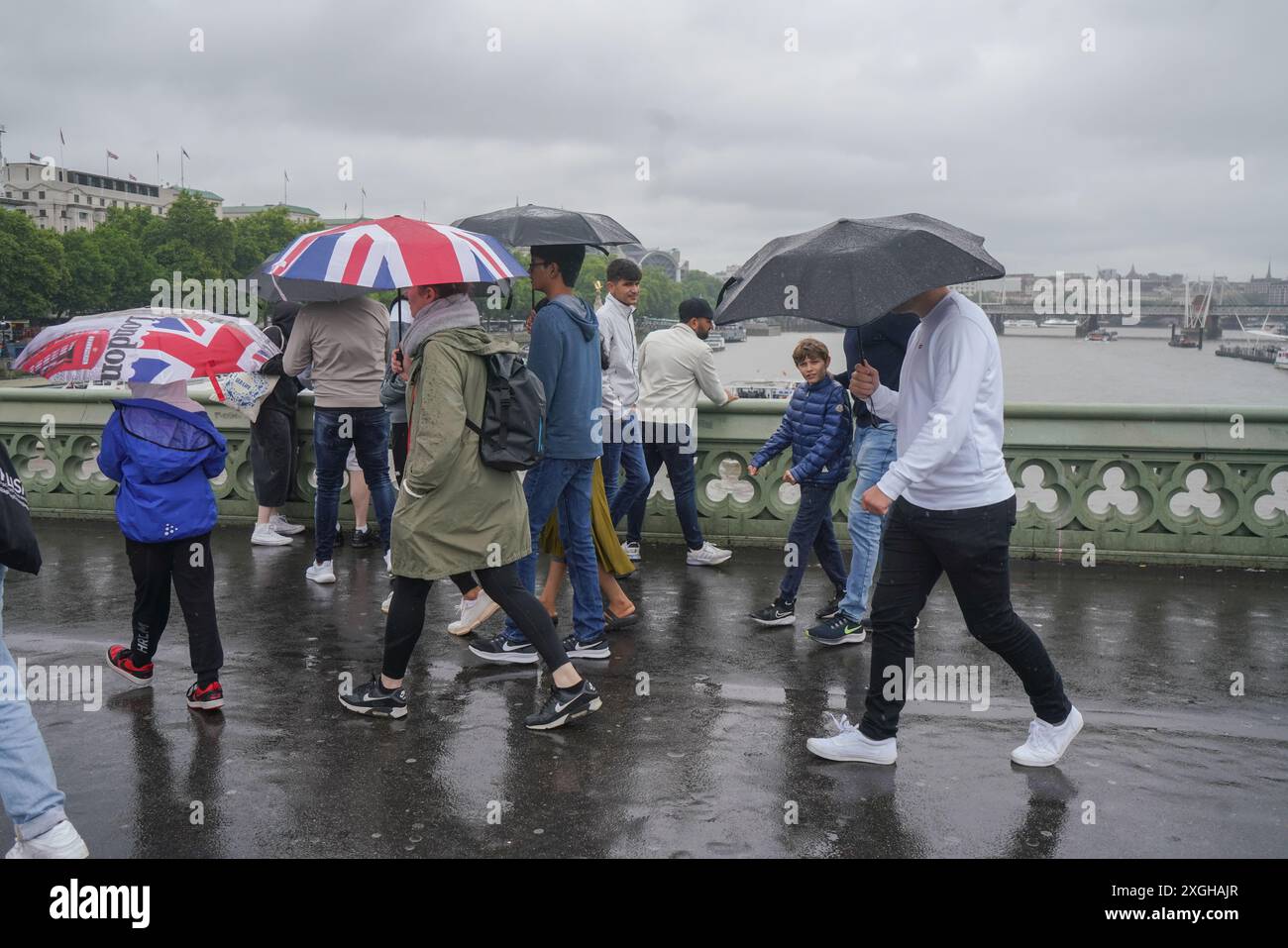London, UK. 9 July 2024 . Pedestrians on Westminster Bridge with ...