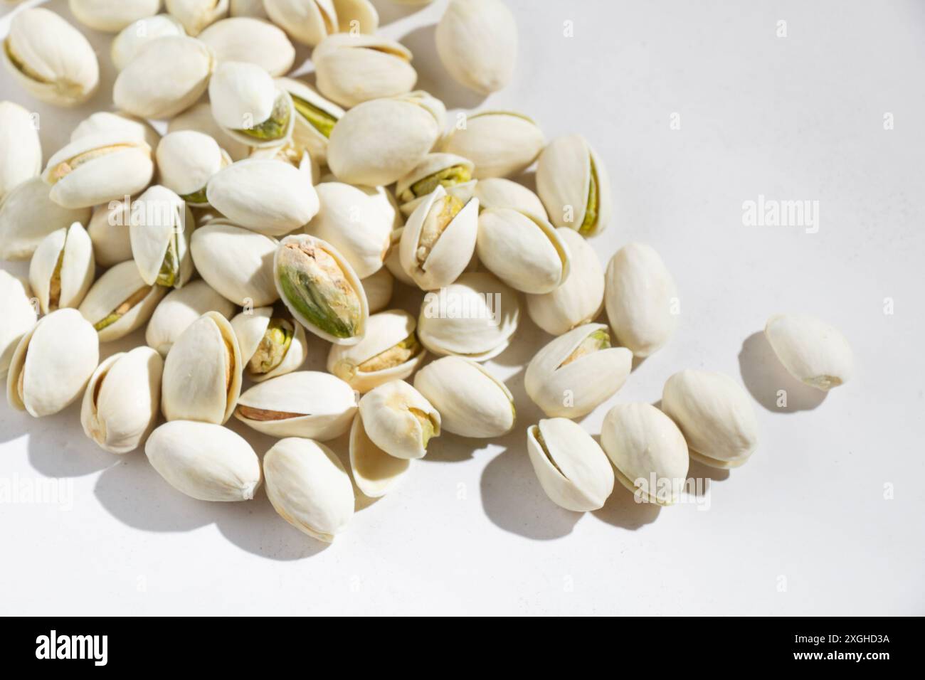 top view Seeds of pistachio nuts, chickpeas, peanuts isolated, white ...