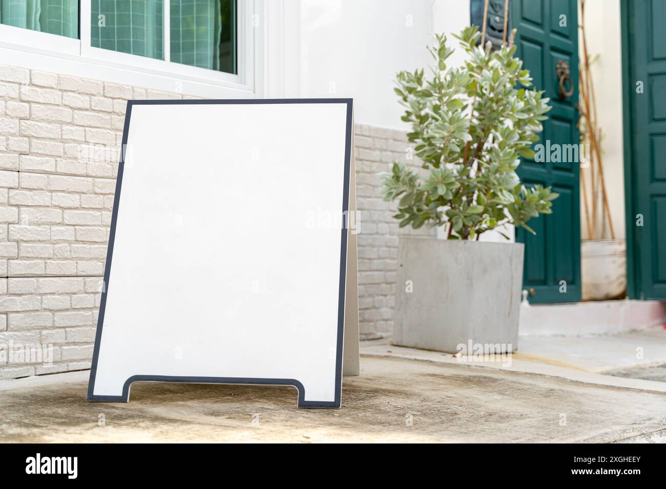Blank restaurant shop sign or menu board near the entrance to ...