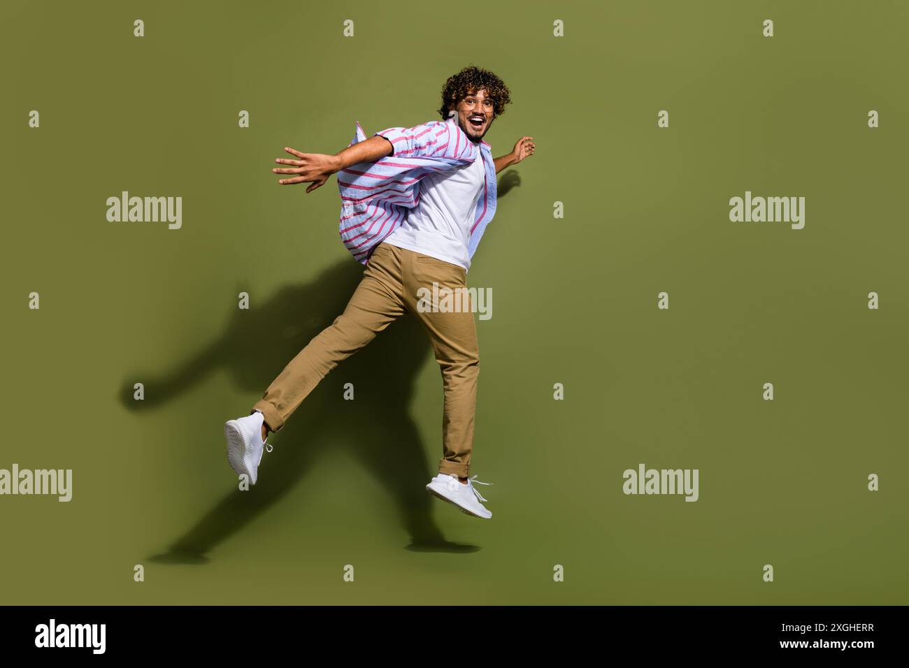 Full size photo of eccentric guy dressed striped shirt brown pants ...