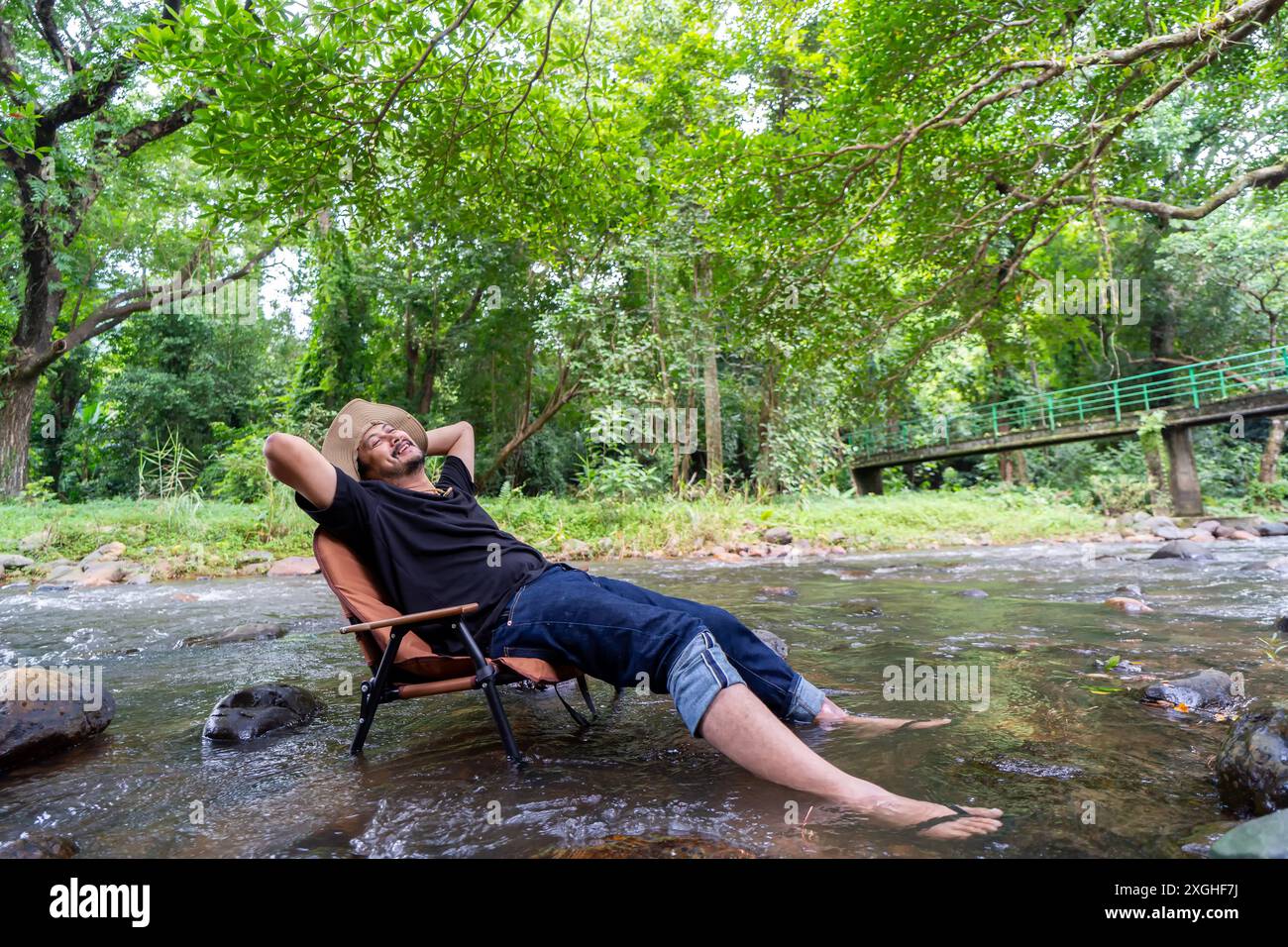 Handsome man resting on river hi-res stock photography and images - Alamy