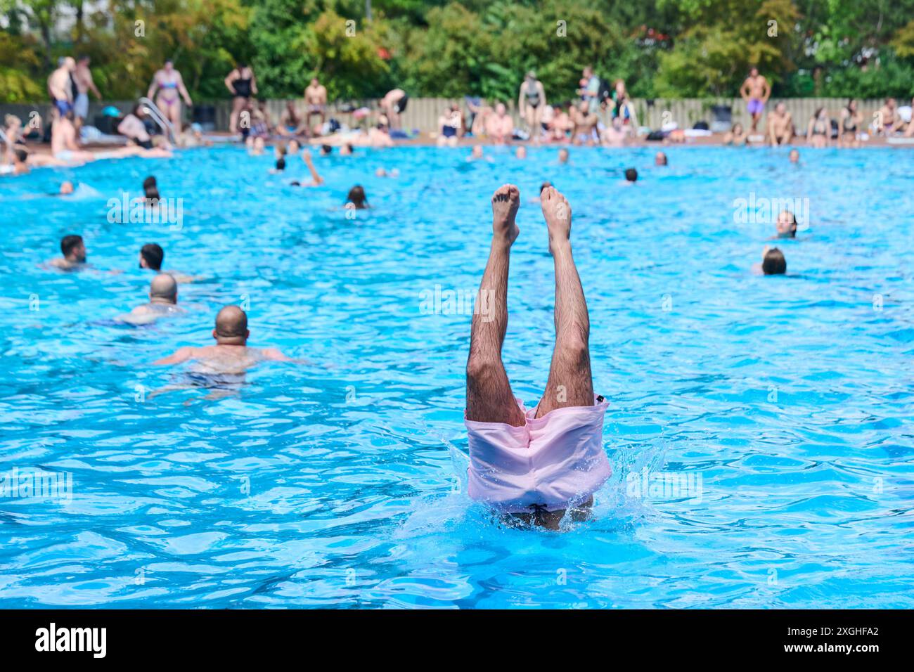 09 July 2024, Berlin: Children and adults frolic in the Prinzenbad in ...